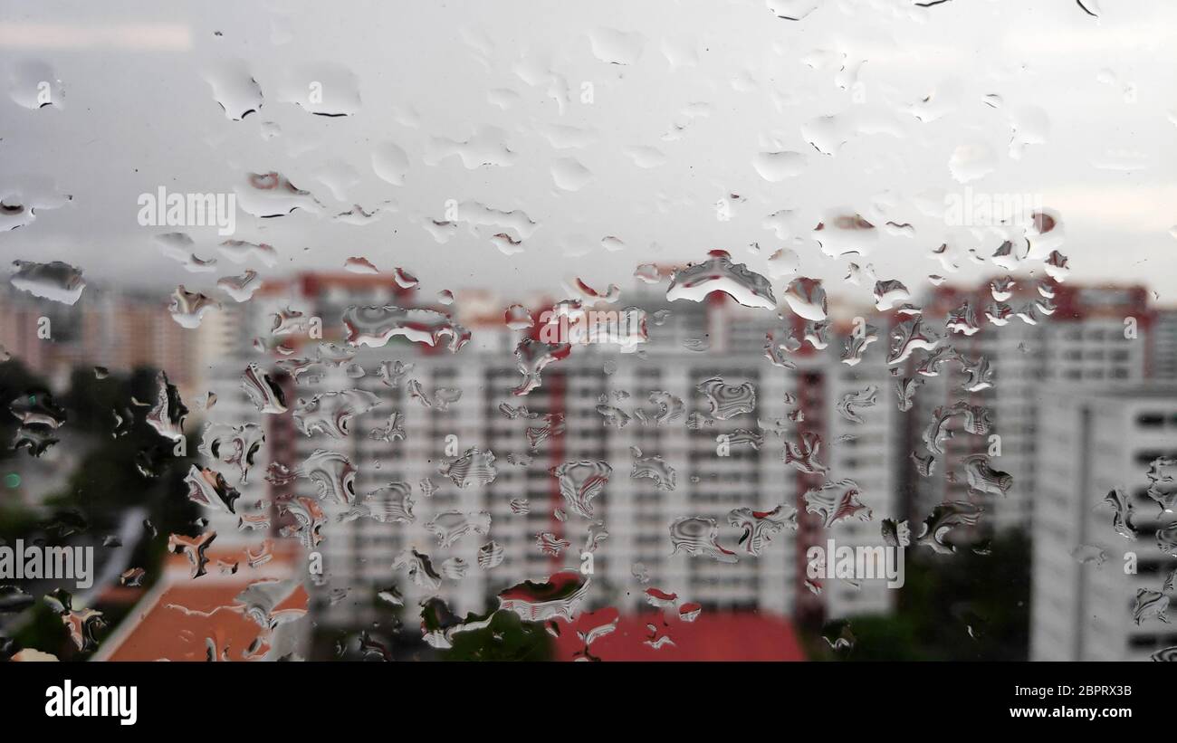 Water drop on glass with building as background Stock Photo - Alamy
