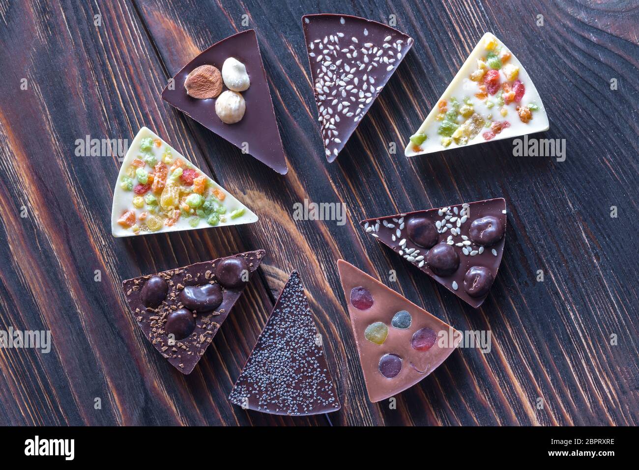 Chocolate candies with different toppings Stock Photo - Alamy