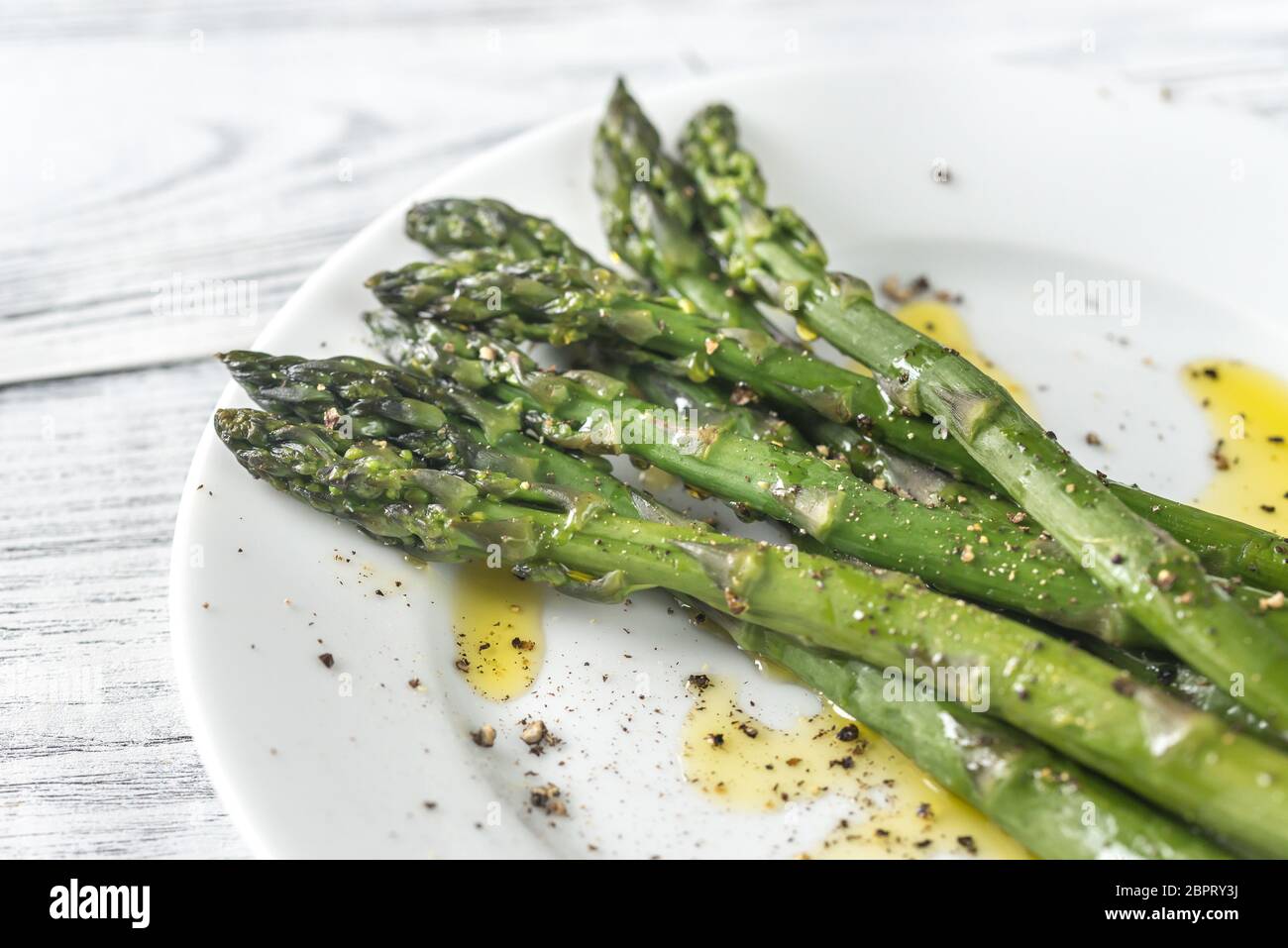 Cooked asparagus on the plate Stock Photo - Alamy