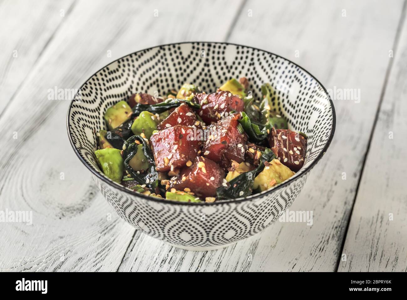 Bowl of poke - traditional Hawaiian dish Stock Photo - Alamy