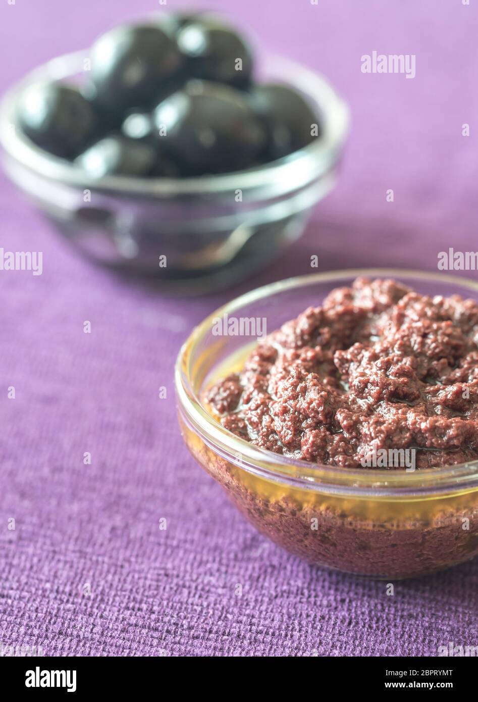 Bowl of black olive pate Stock Photo - Alamy
