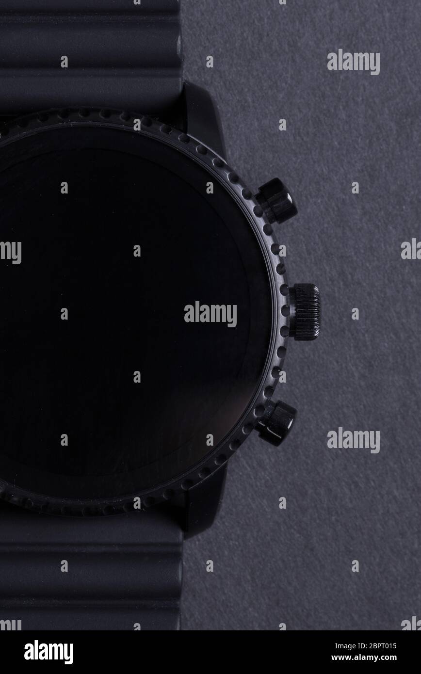 Black smartwatch isolated on a black background Stock Photo - Alamy