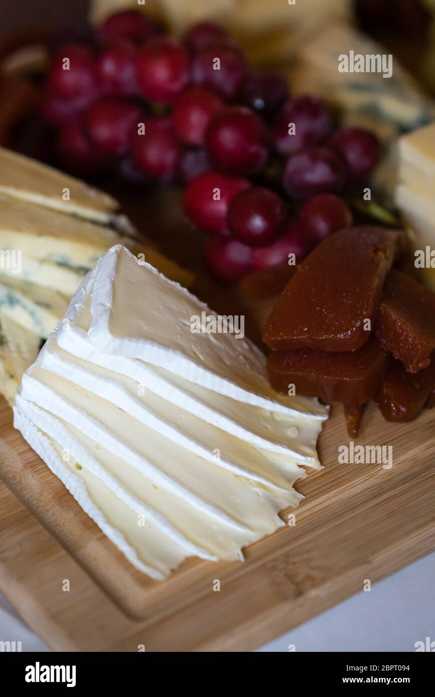 Cheese platter with different cheeses including brie, cheddar and blue ...