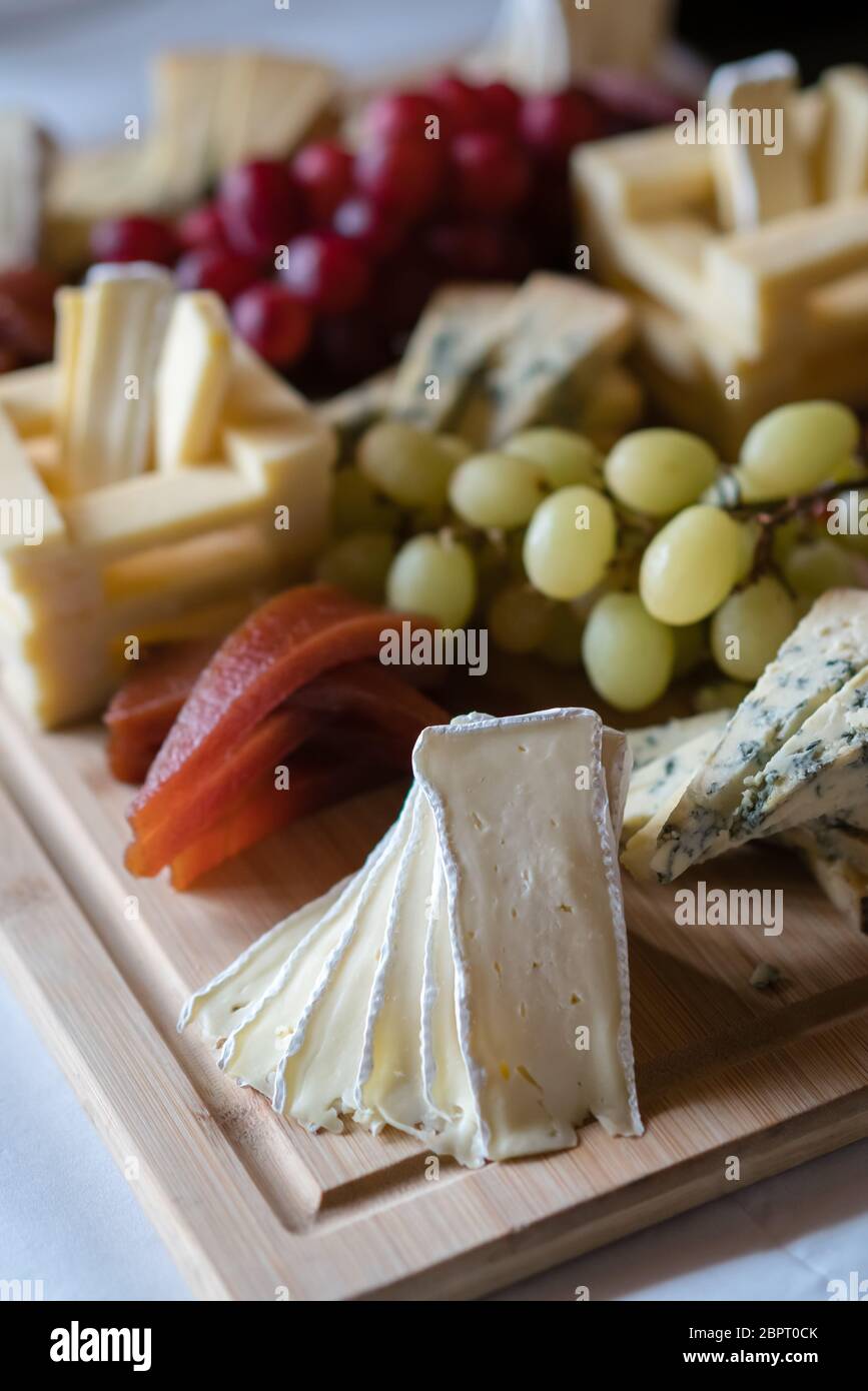 Cheese platter with different cheeses including brie, cheddar and blue ...