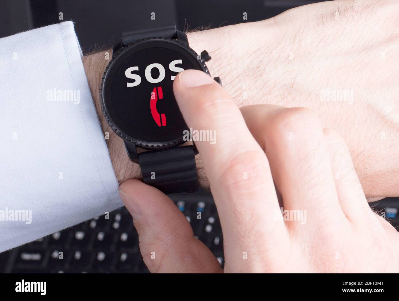 Black smartwatch isolated on a black background, SOS Stock Photo - Alamy