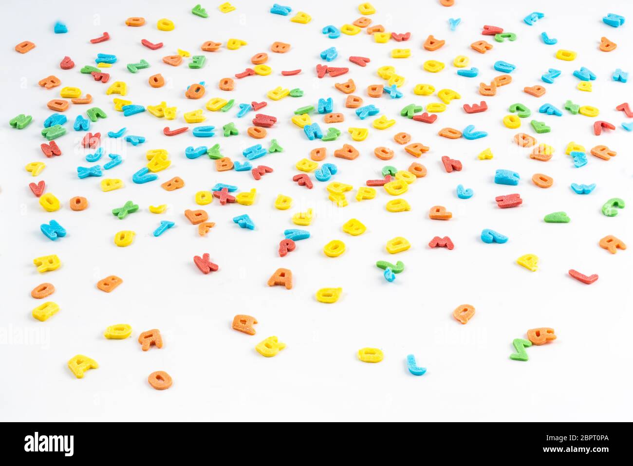 the colorful letters scattered on a white surface Stock Photo - Alamy