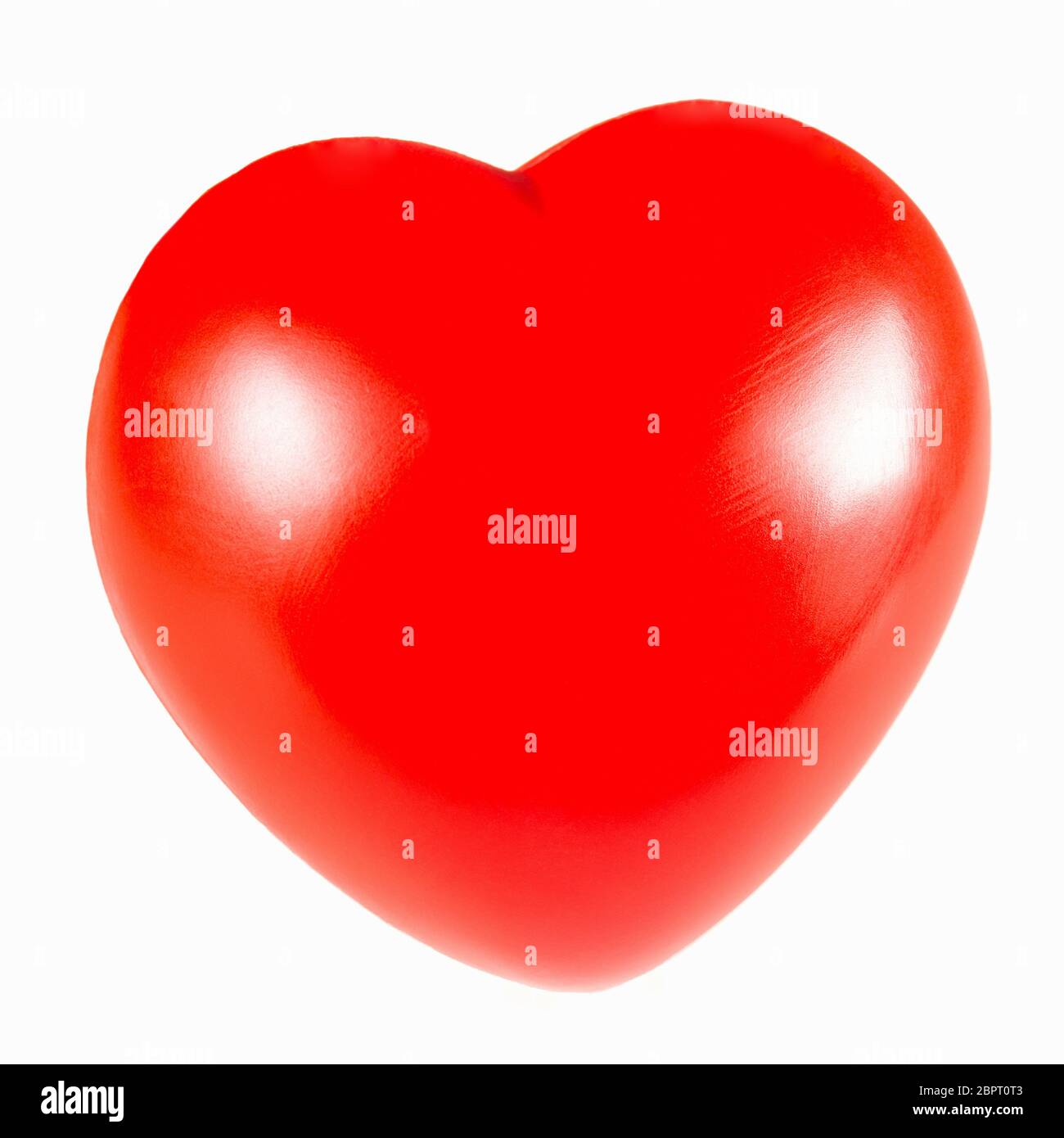 The red heart shape toy is isolated on white background Stock Photo - Alamy