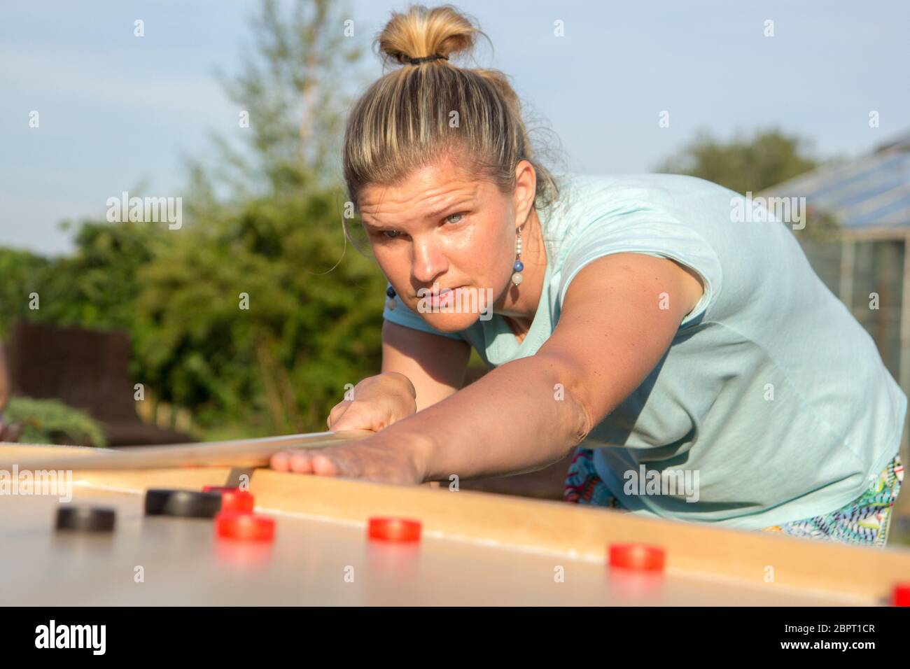 Women playing Novuss in outdoors. Novuss is a national sport in Latvia ...