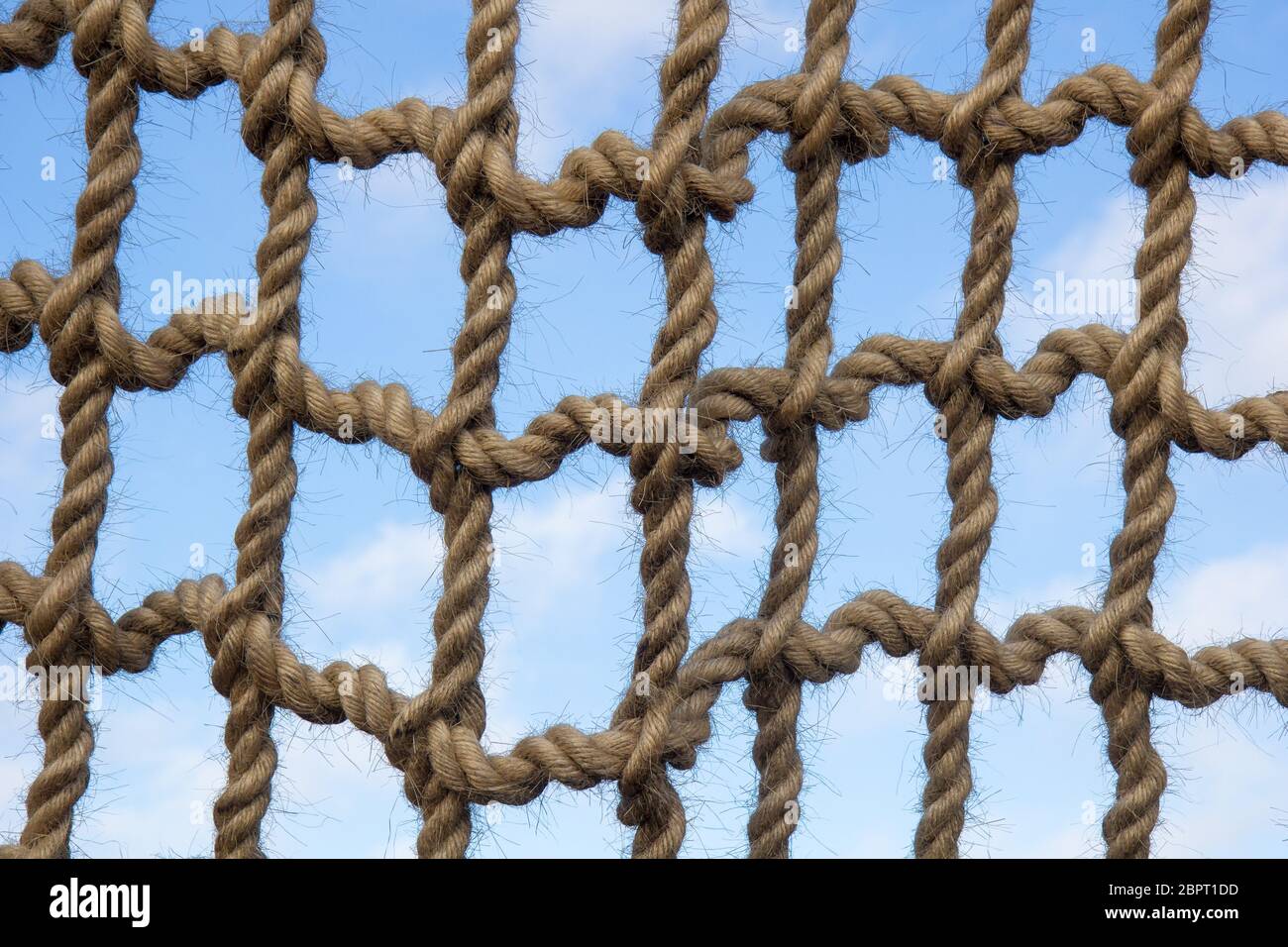 Net from large ropes against blue sky Stock Photo - Alamy