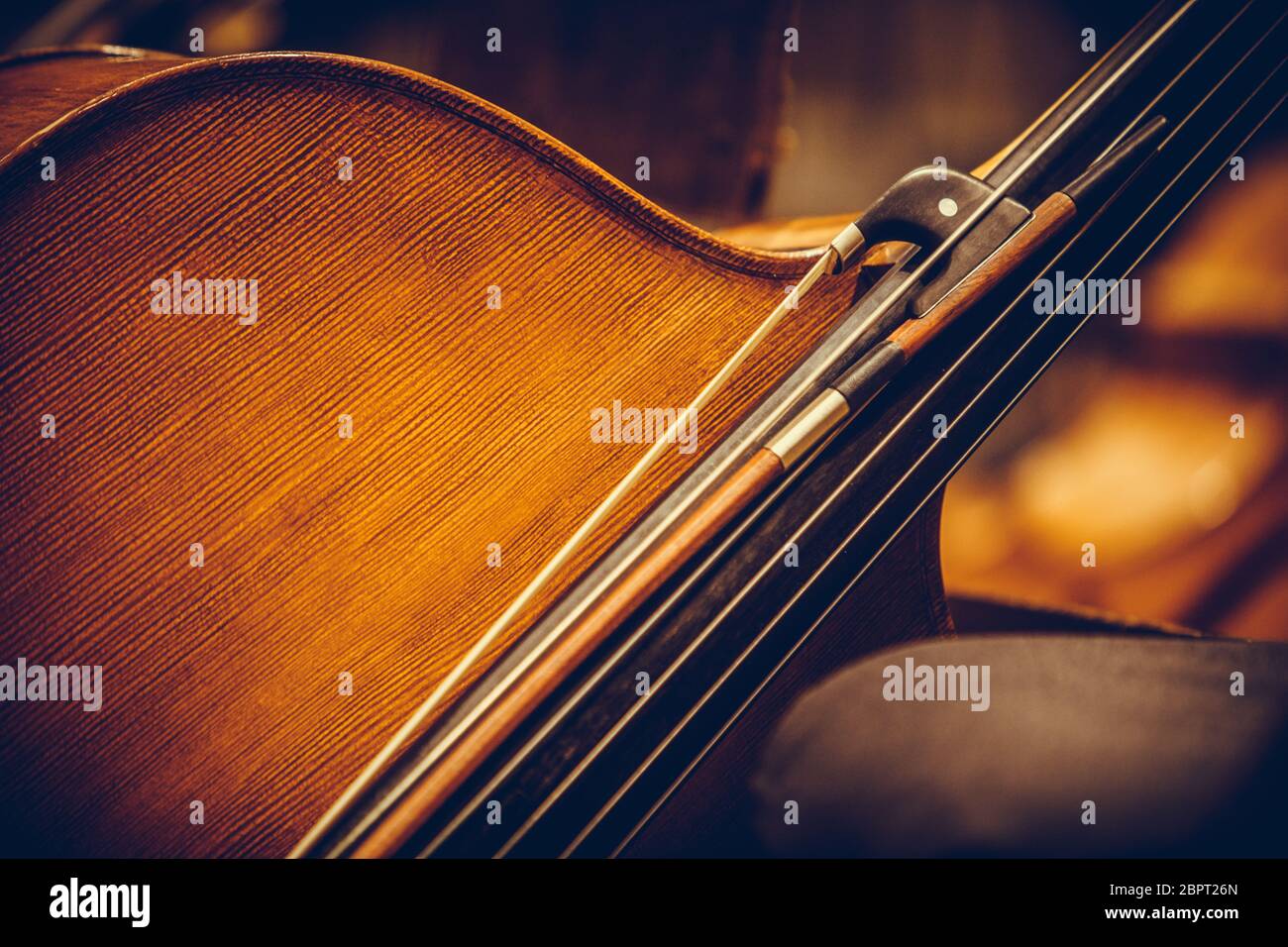 Close up shot of a double bass and a bow Stock Photo - Alamy