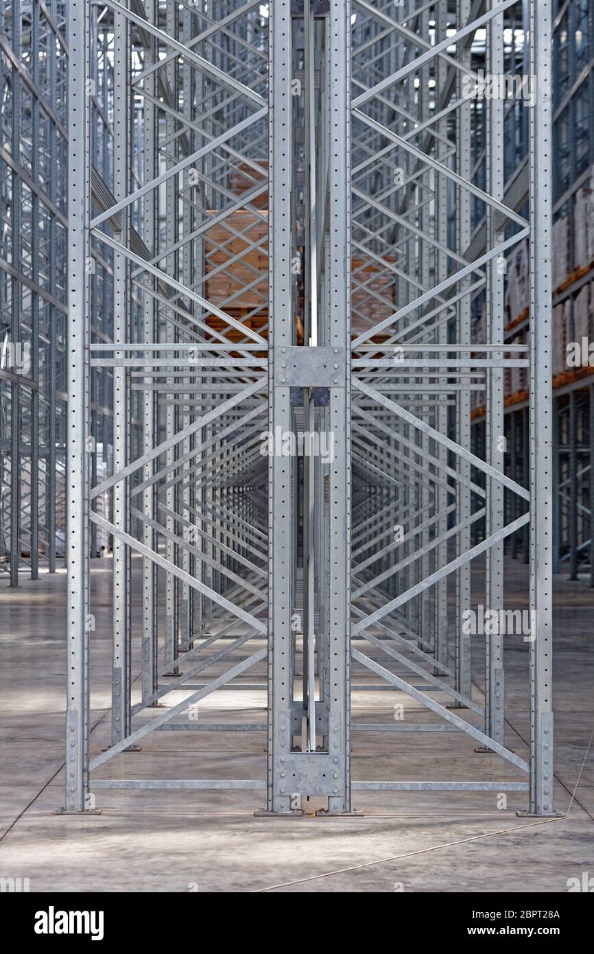 Steel Shelving Racks in New Distribution Warehouse Stock Photo - Alamy