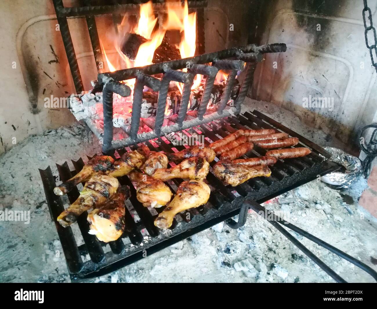 Grilled meat cooked on fireplace Stock Photo - Alamy