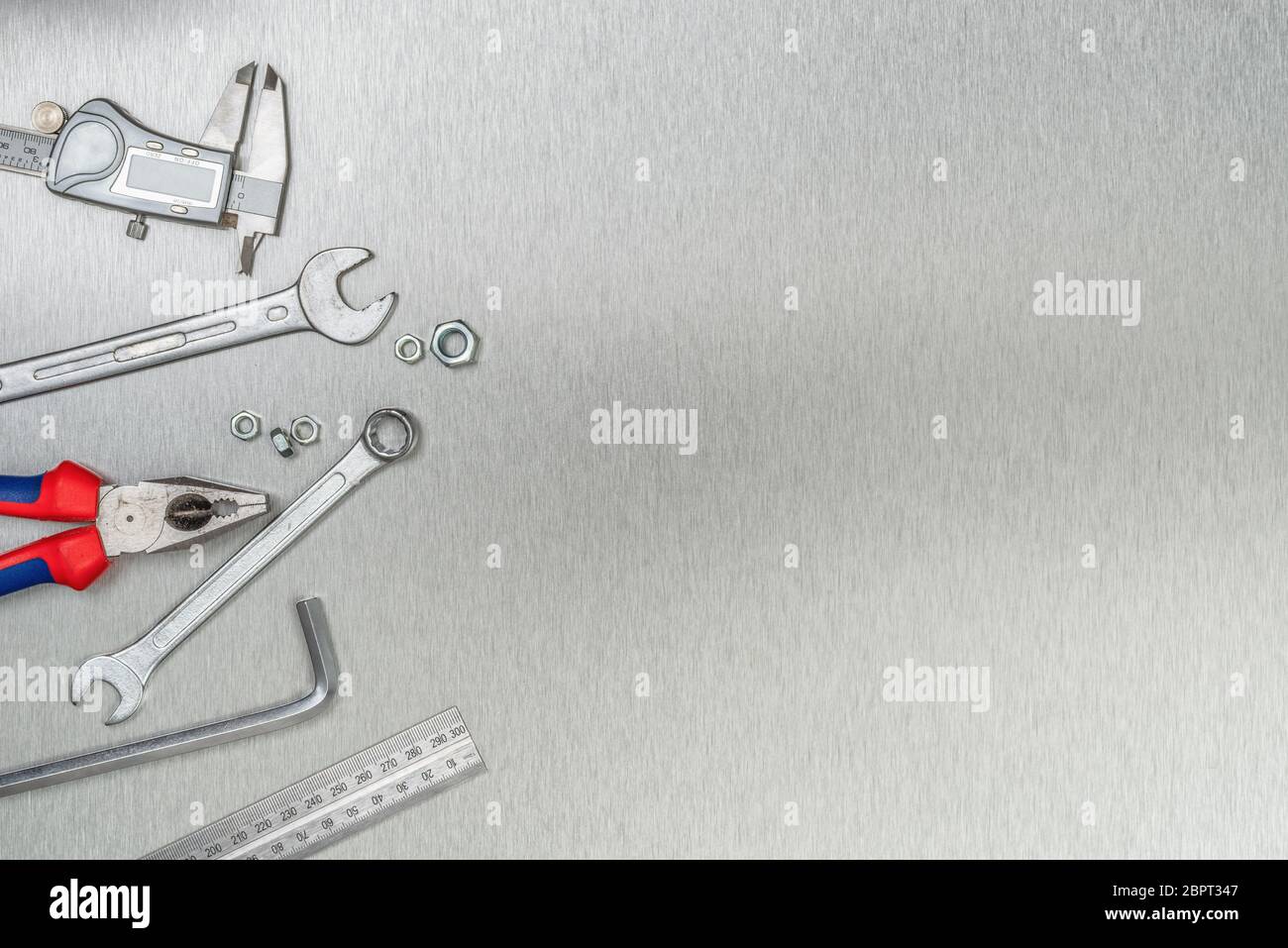 Tools on a metal background with copy space Stock Photo - Alamy