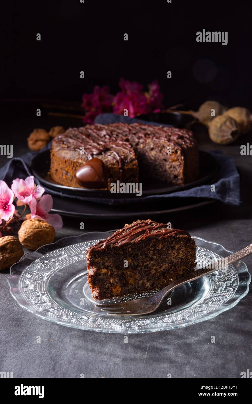 juicy poppy seed cake with apples and chocolate glaze Stock Photo - Alamy