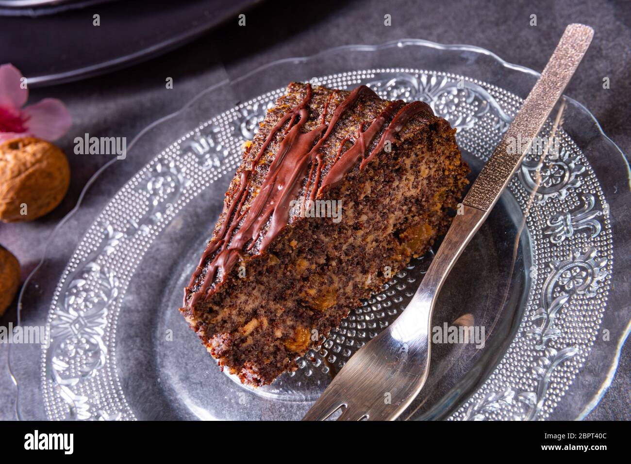 juicy poppy seed cake with apples and chocolate glaze Stock Photo - Alamy