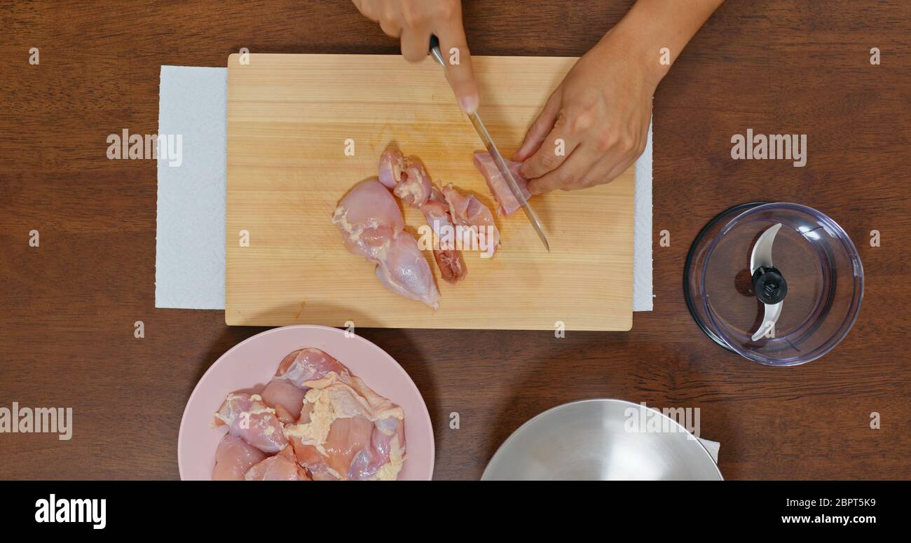 Top view of chopping chicken fillet Stock Photo - Alamy