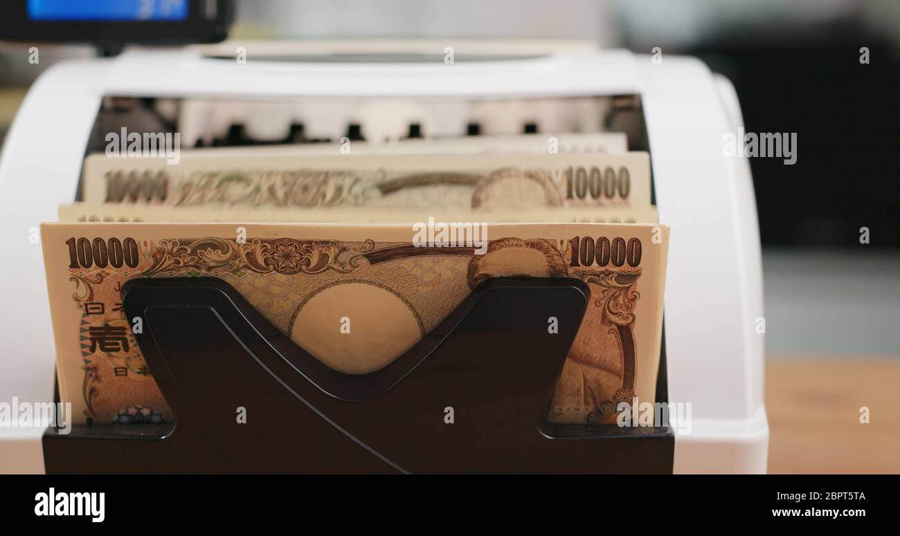 Money counting machine for Japanese banknote machine Stock Photo - Alamy