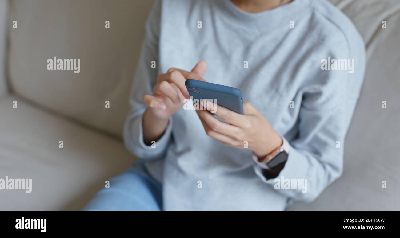 Use of mobile phone at home Stock Photo - Alamy