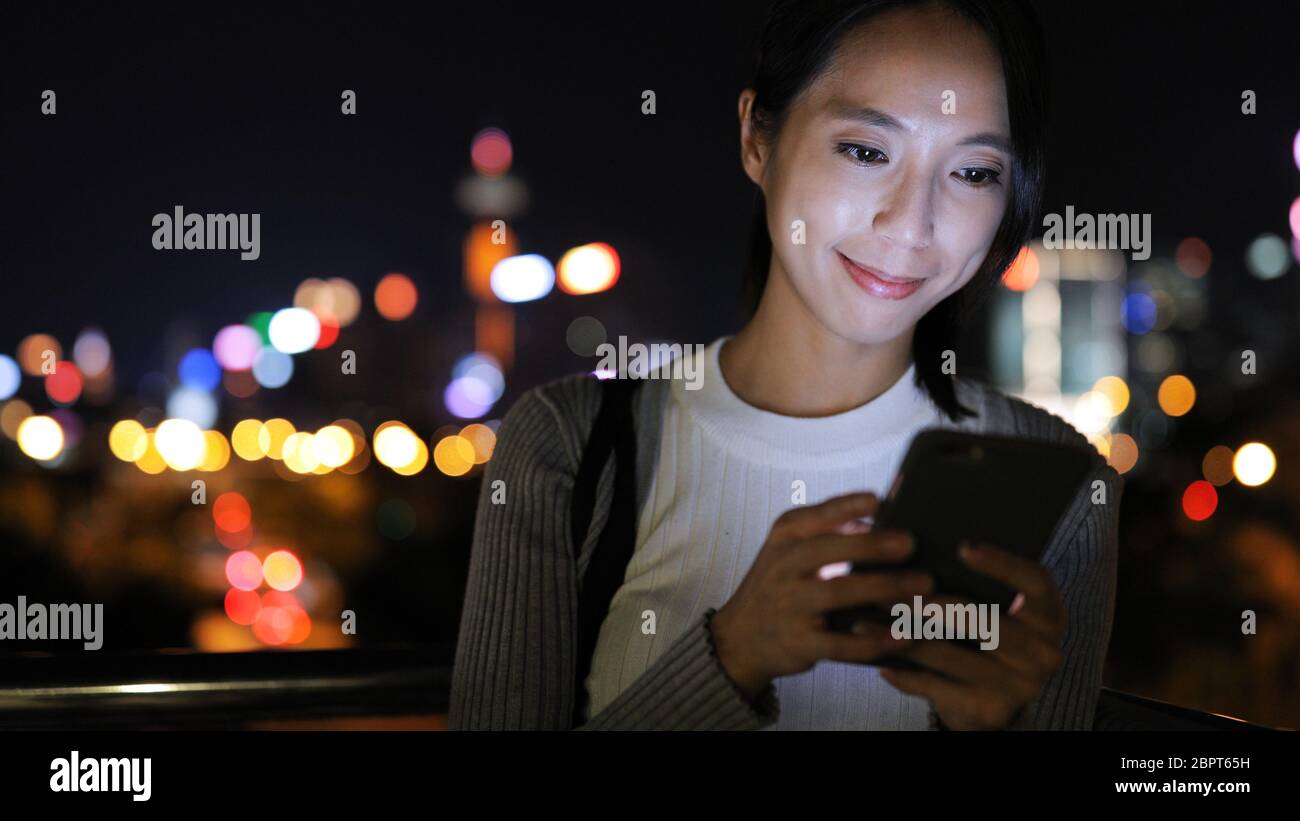 Woman use of mobile phone Stock Photo - Alamy