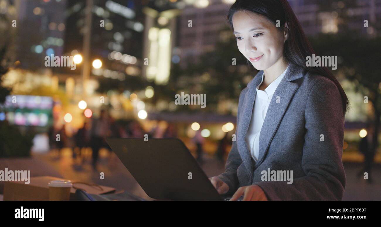Woman use of computer at night Stock Photo - Alamy