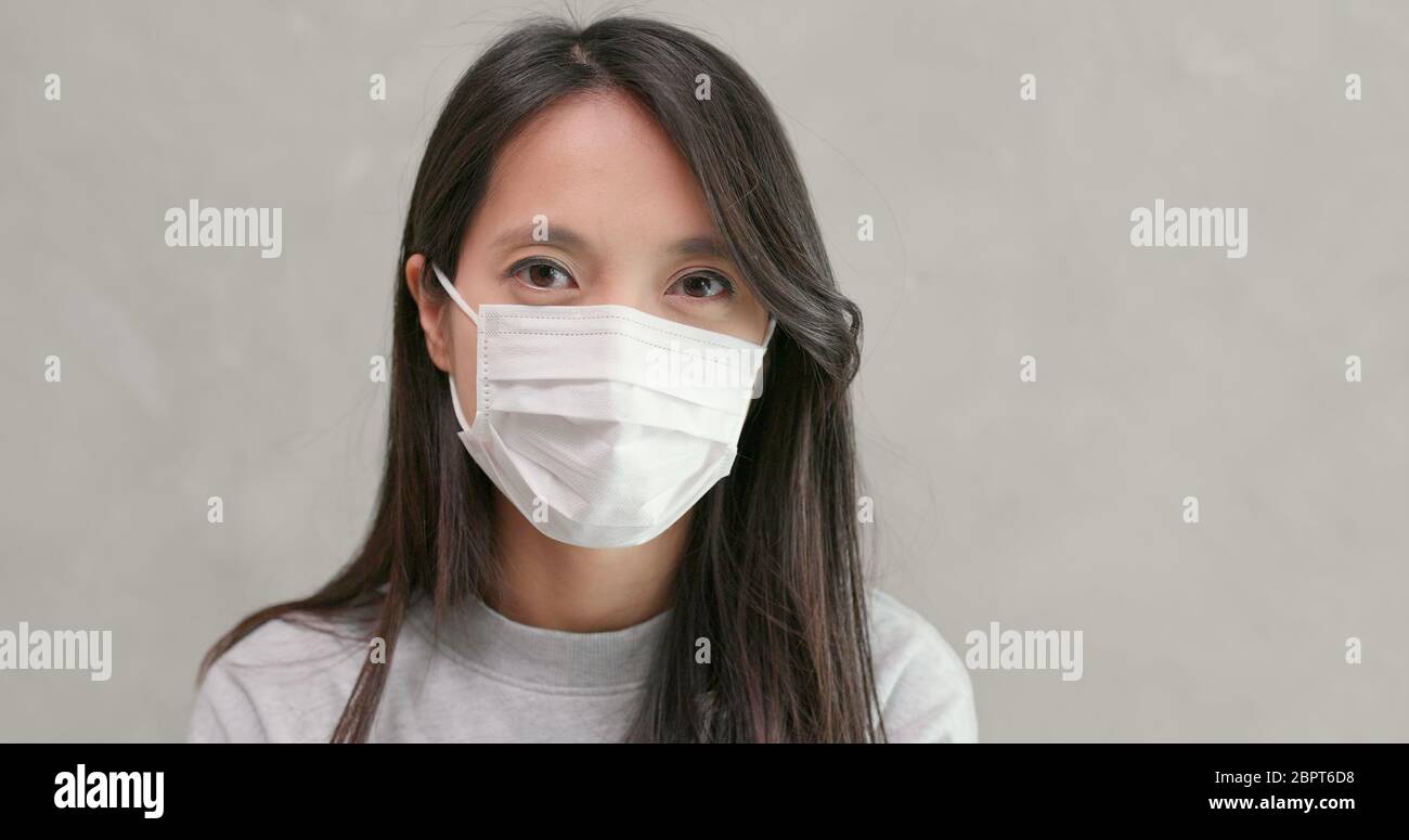 Woman taking off facial mask Stock Photo - Alamy