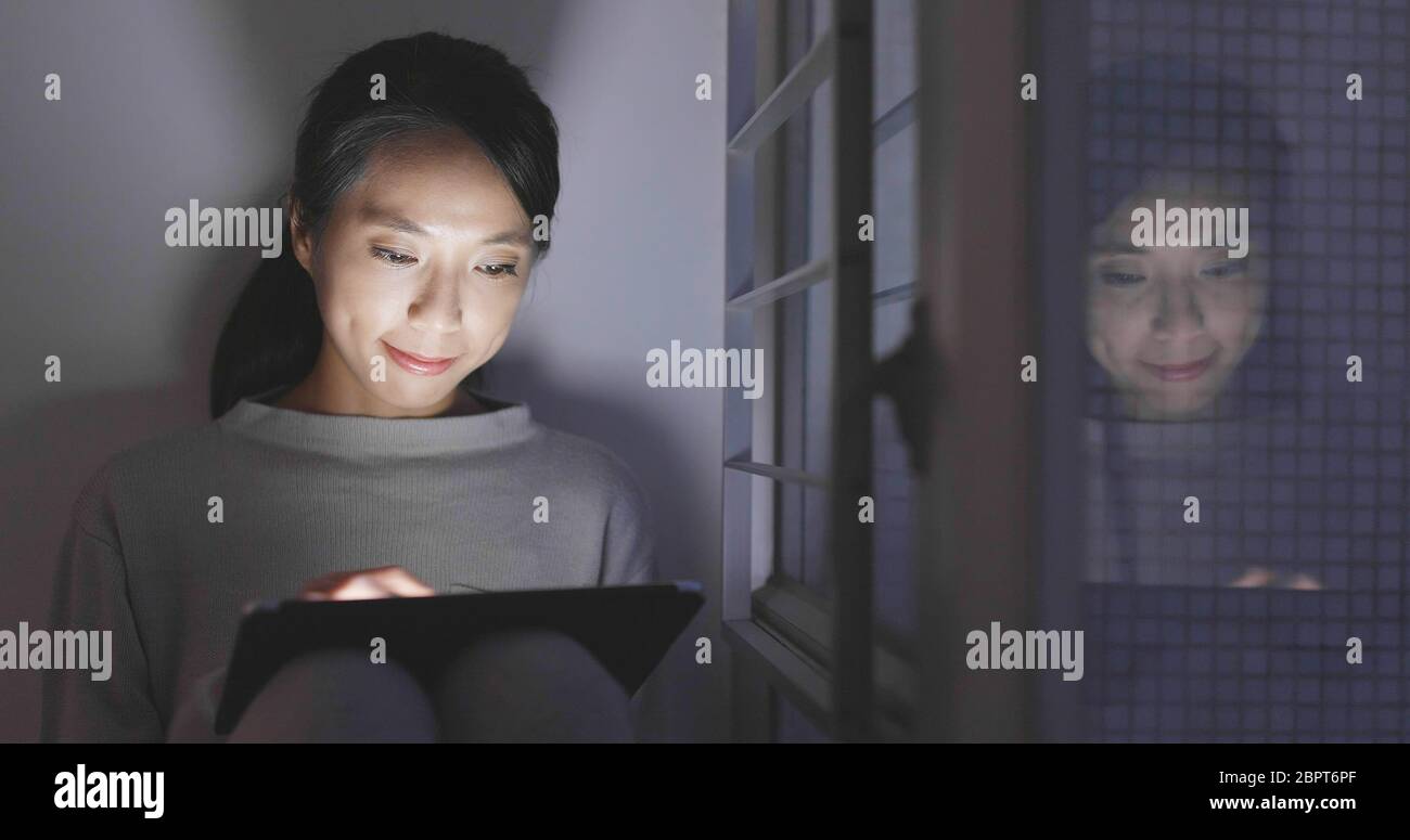 Woman look tablet night hi-res stock photography and images - Alamy