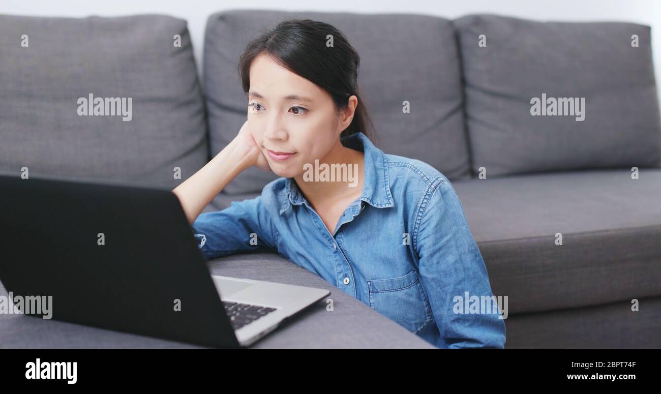 Woman watching on laptop computer Stock Photo - Alamy