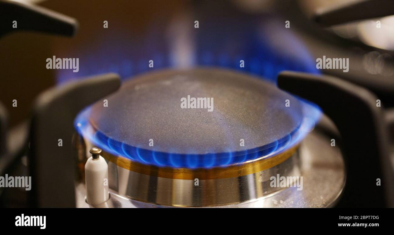 Gas burner on the stove in the kitchen Stock Photo - Alamy