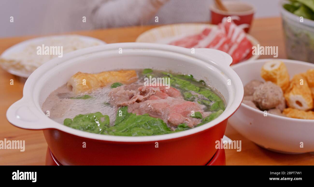 Family having hot pot at home Stock Photo - Alamy