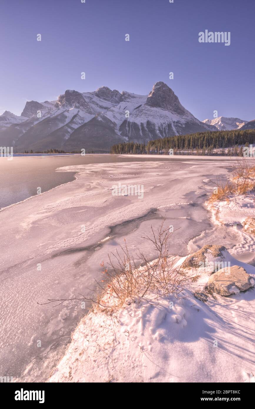 Landscape of Goat Pond with blue sky, Rocky Mountainsi n the background ...
