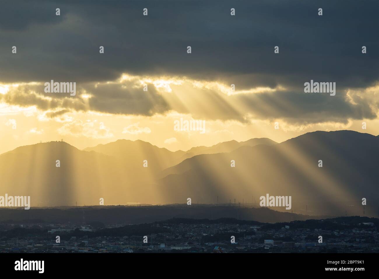 Beautiful sun flare though the cloud Stock Photo - Alamy
