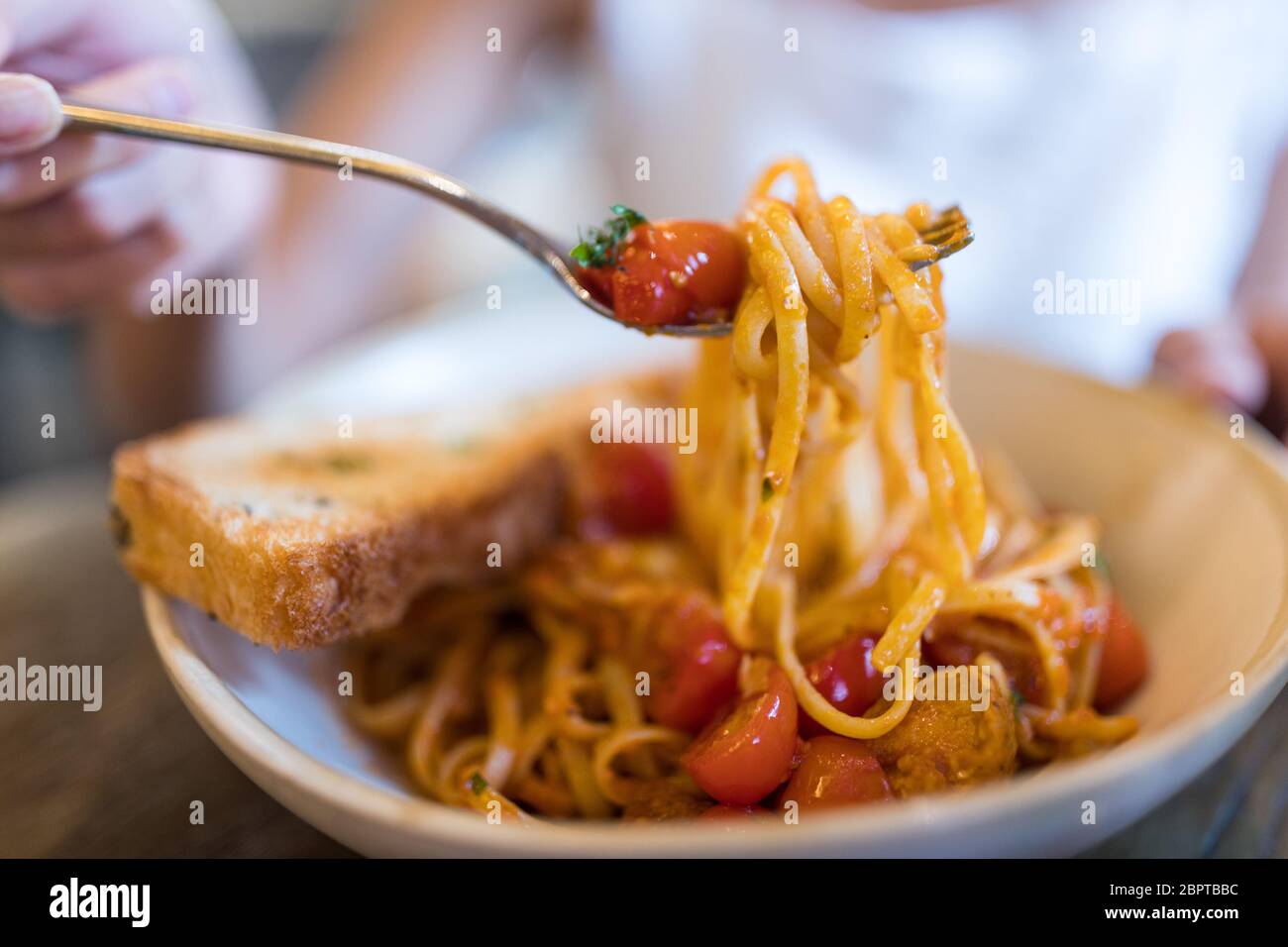 Enjoy tomato pasta Stock Photo - Alamy