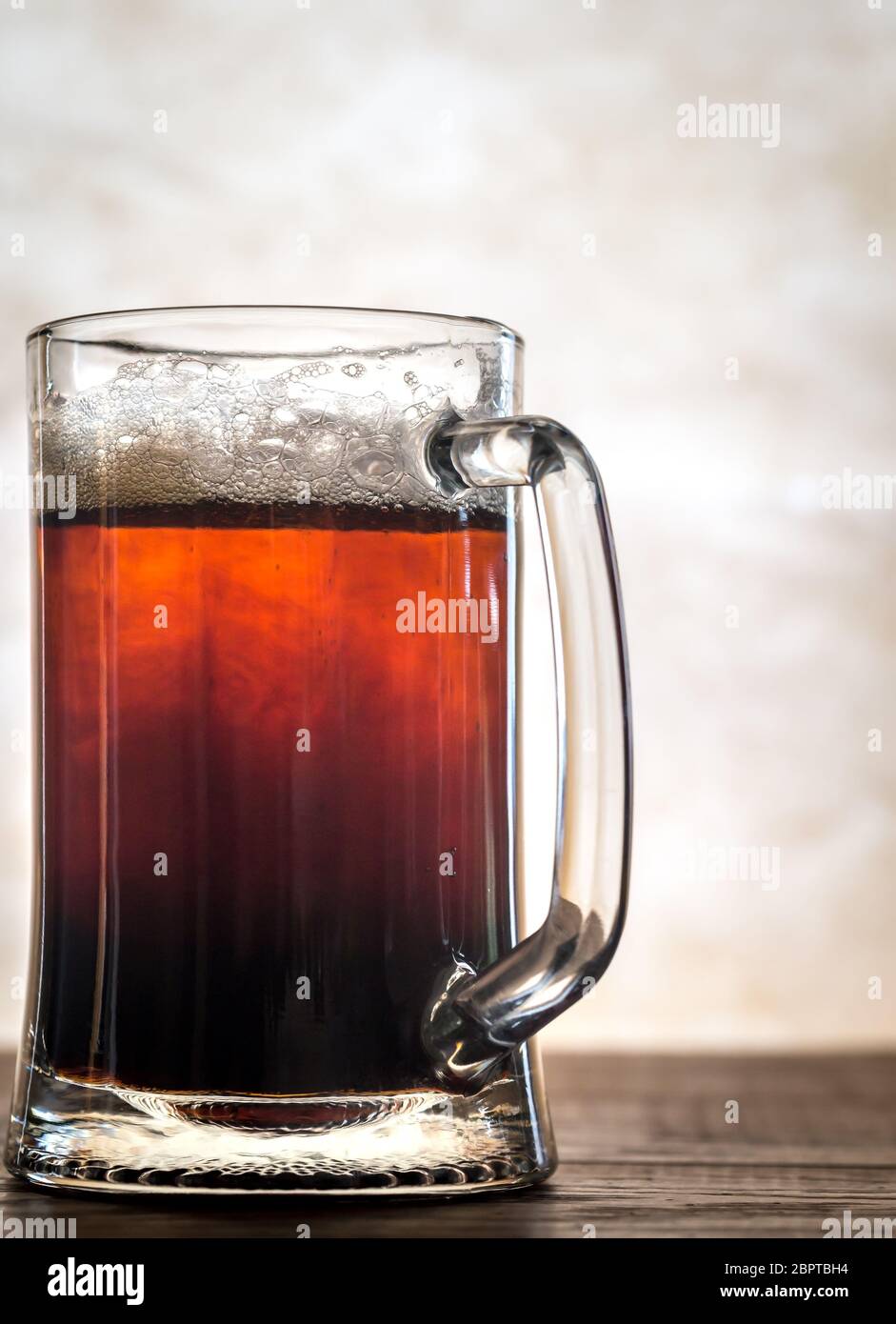 Black and Tan - beer cocktail of pale and dark beer in the mug Stock ...