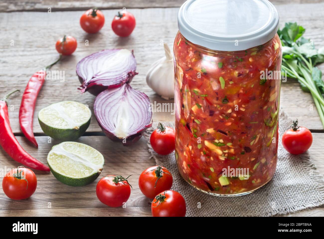 Jar of salsa with ingredients Stock Photo - Alamy
