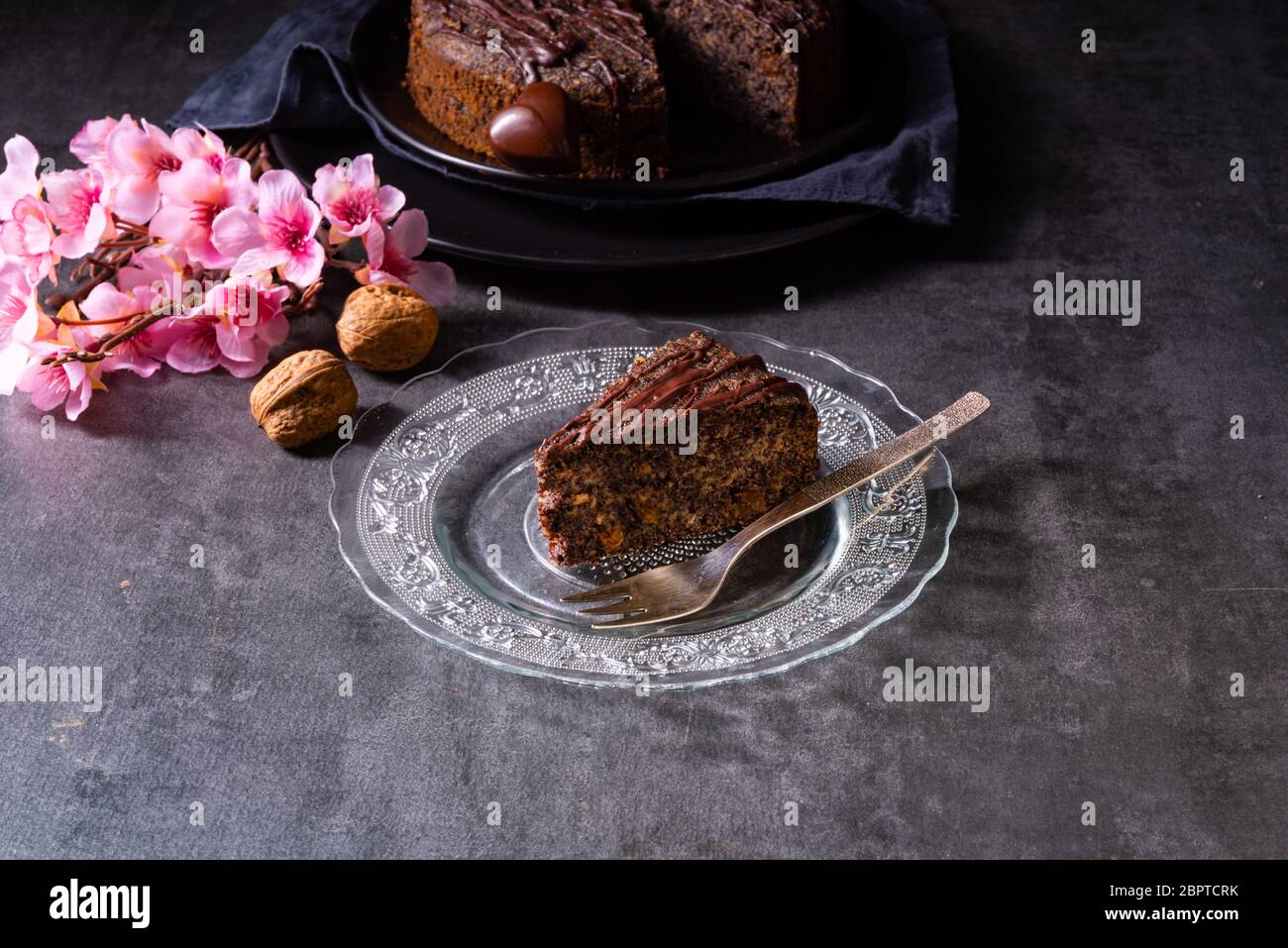 juicy poppy seed cake with apples and chocolate glaze Stock Photo - Alamy