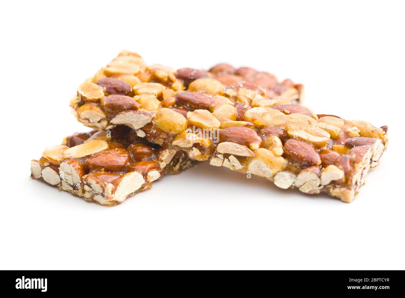 Sweet nut bars with honey isolated on white background Stock Photo - Alamy