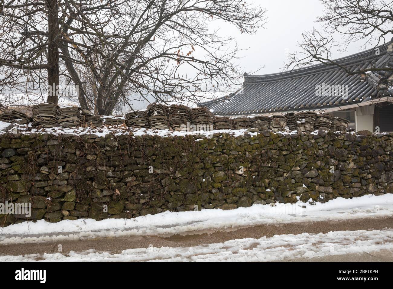 Winter in Korea, snowy traditional village and stone wall, Oeam Folk ...
