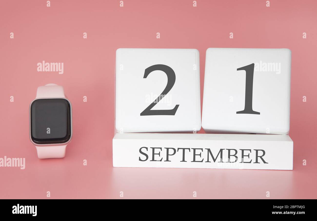 Modern Watch with cube calendar and date 21 september on pink ...
