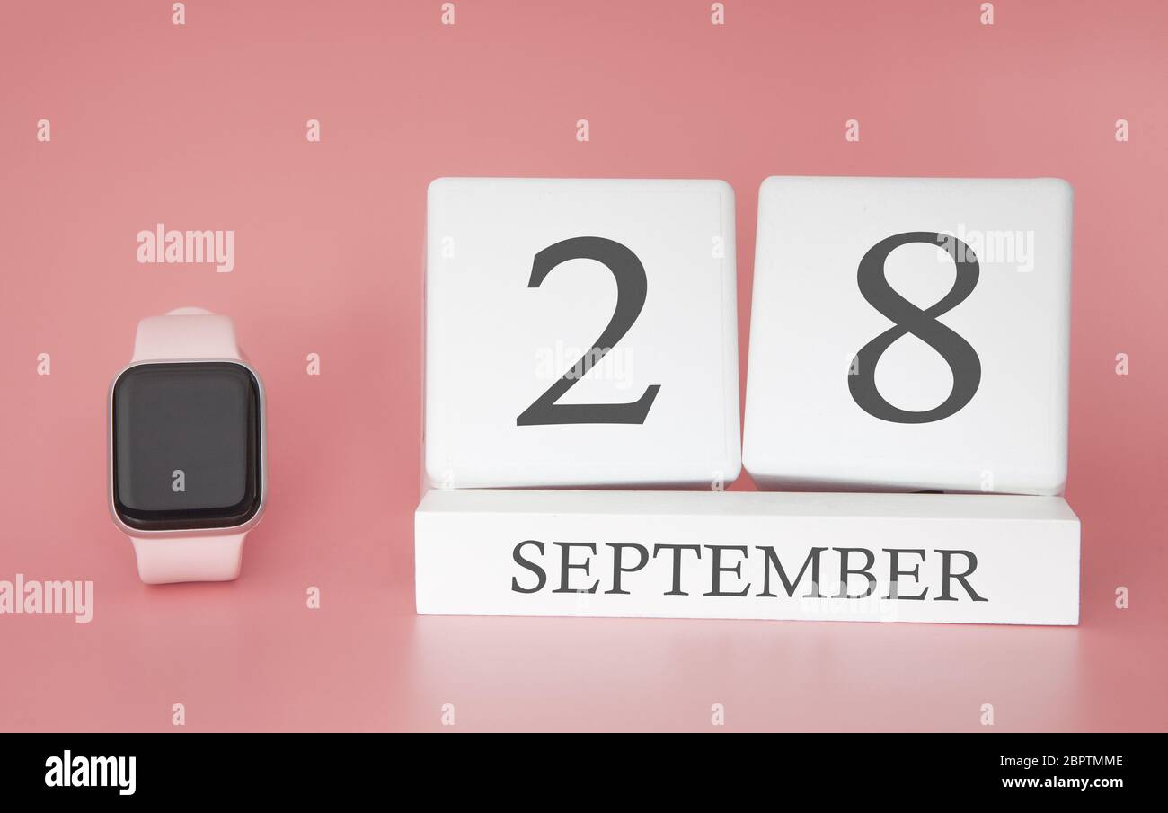 Modern Watch with cube calendar and date 28 september on pink ...