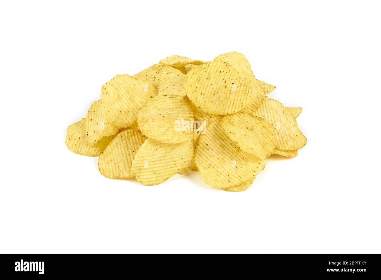 pile of yellow crispy ribbed potato chips isolated on white background ...