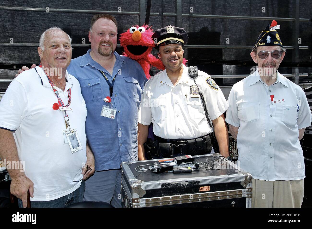 New York, NY, USA. 26 May, 2012. Elmo, poses with veterans at the ...