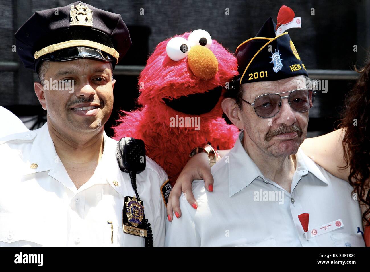 New York, NY, USA. 26 May, 2012. Elmo, poses with veterans at the ...