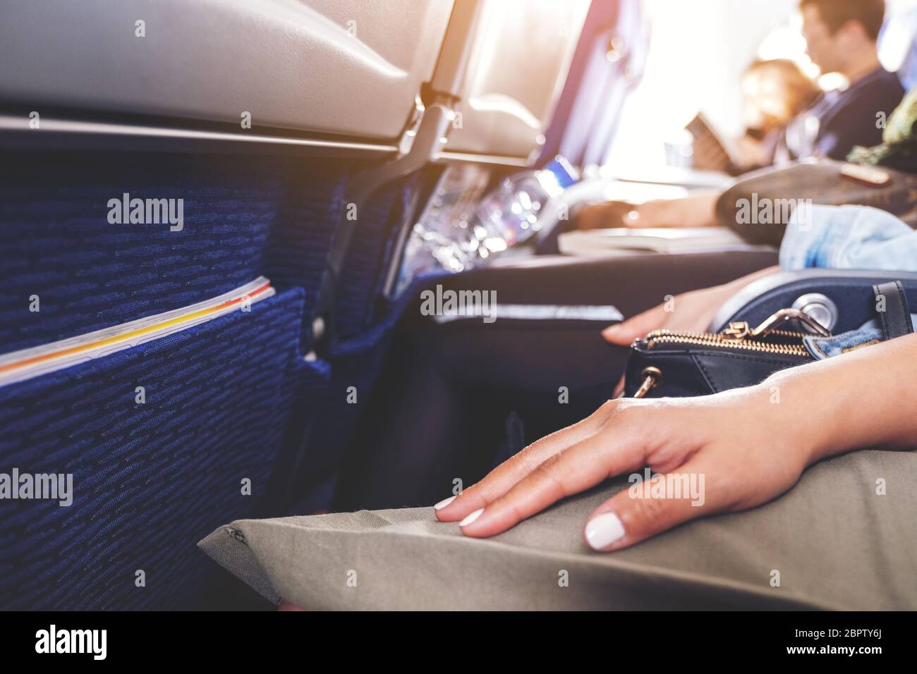 People sitting in plane seats hi-res stock photography and images - Alamy