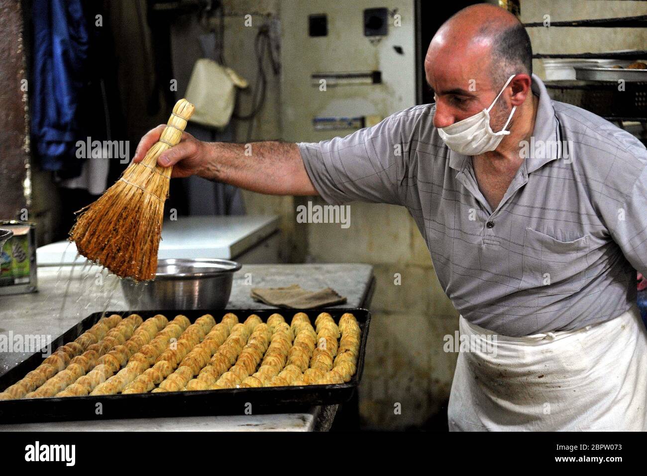 Damascus, Syria. 19th May, 2020. A patissier makes Ma'amoul, a kind of ...