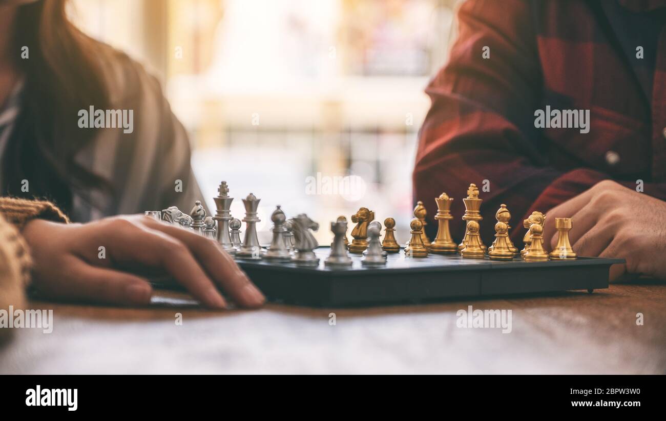 Closeup image of people playing chessboard game together Stock Photo ...