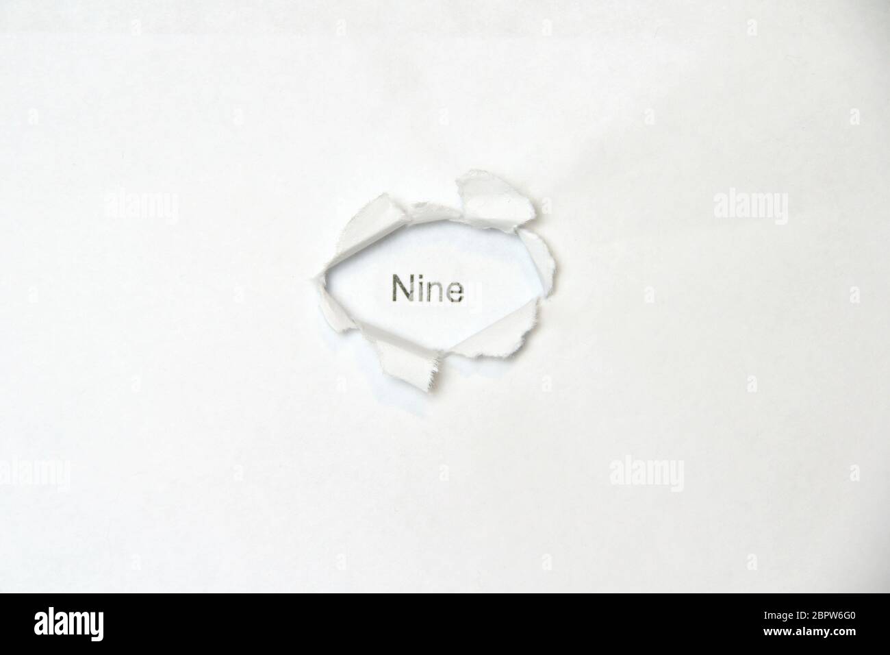 Word nine on white isolated background, the inscription through the ...