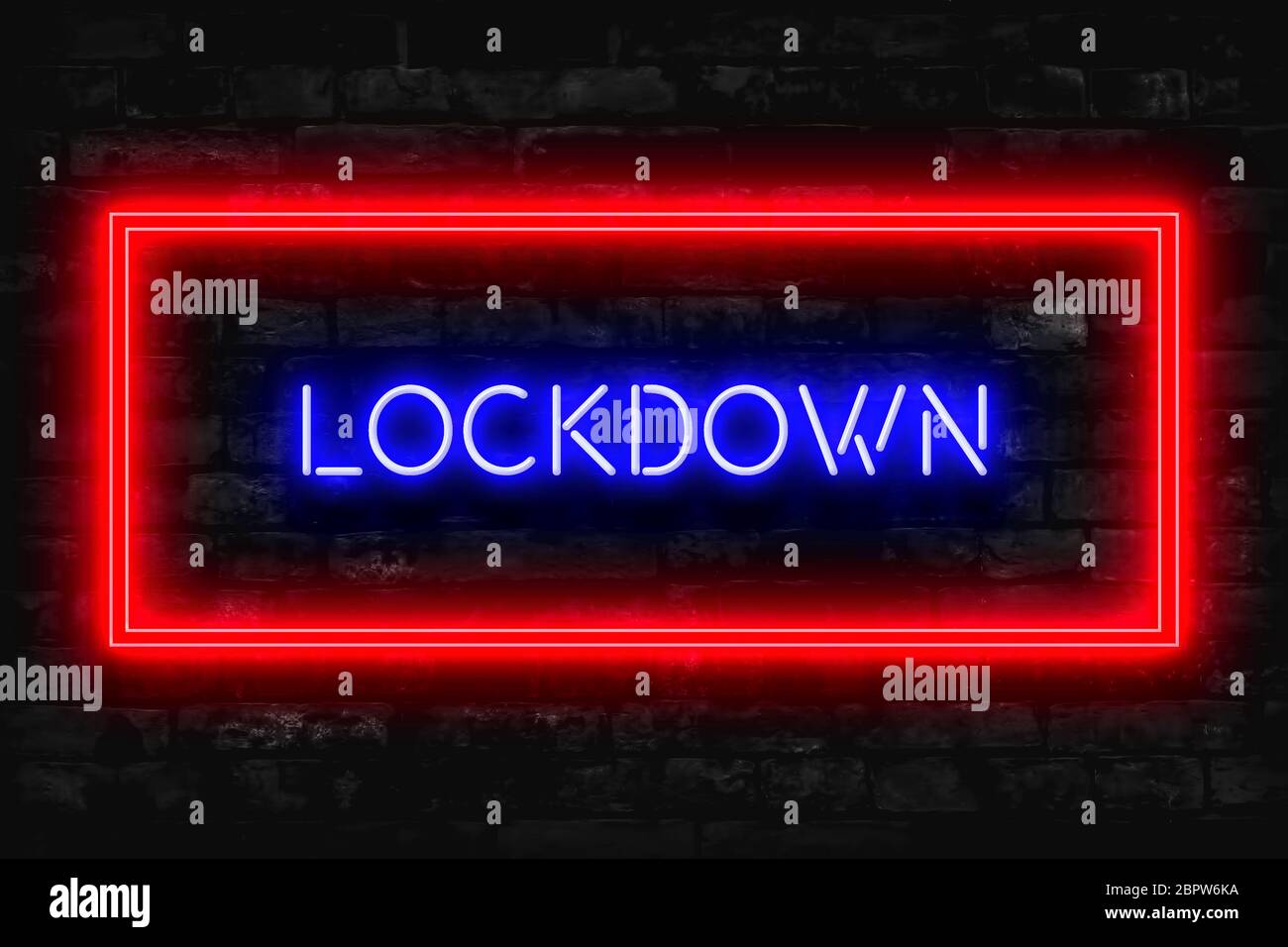 Lockdown Neon sign on a dark brick background Stock Photo - Alamy
