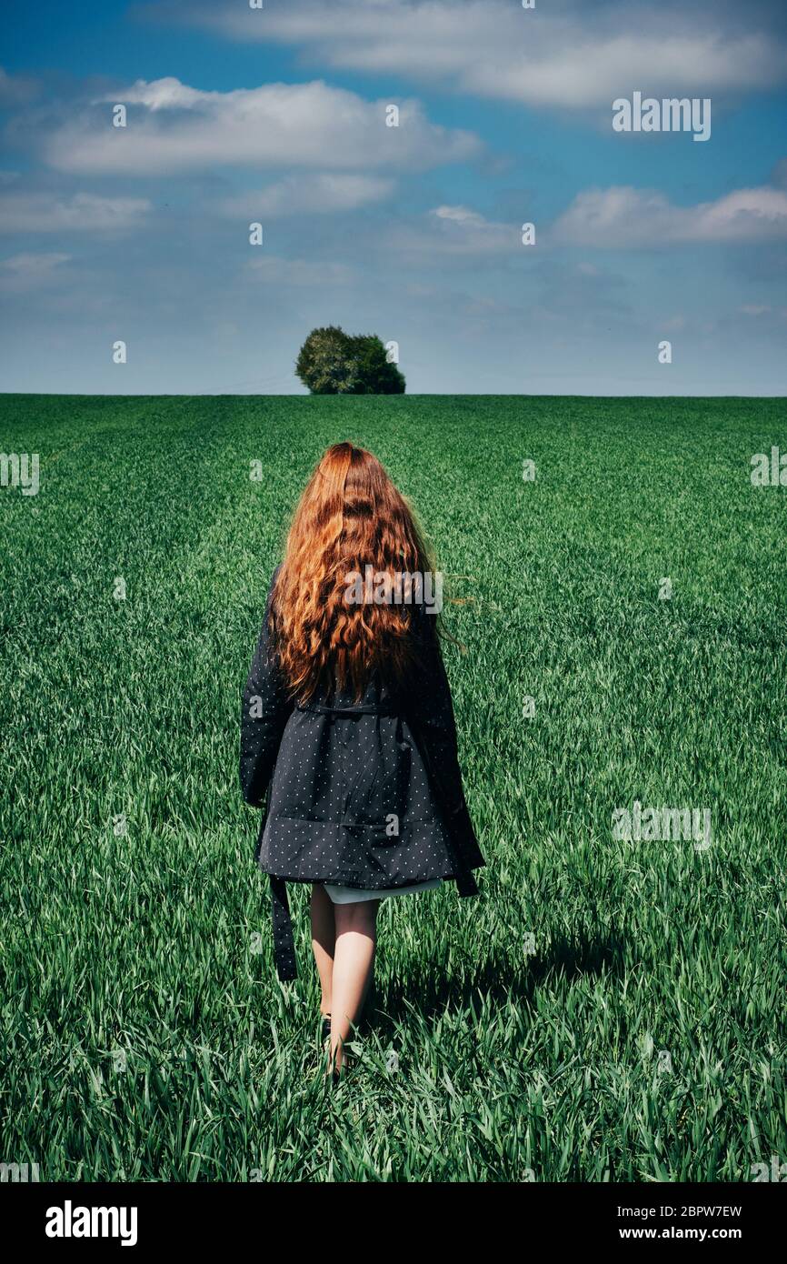 Woman walking in field hi-res stock photography and images - Alamy