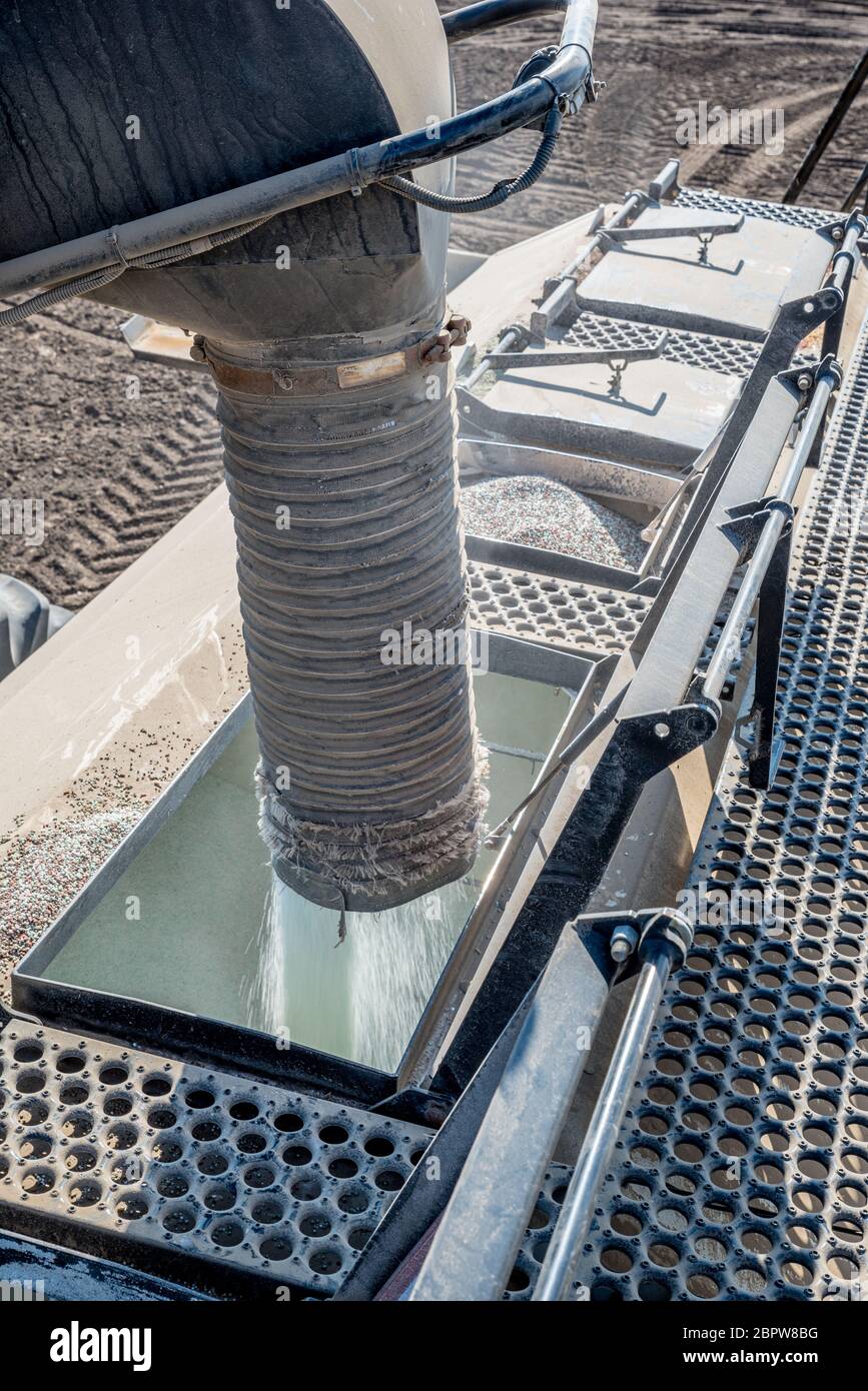 Loading fertilizer from the semi into the air drill for seeding in ...