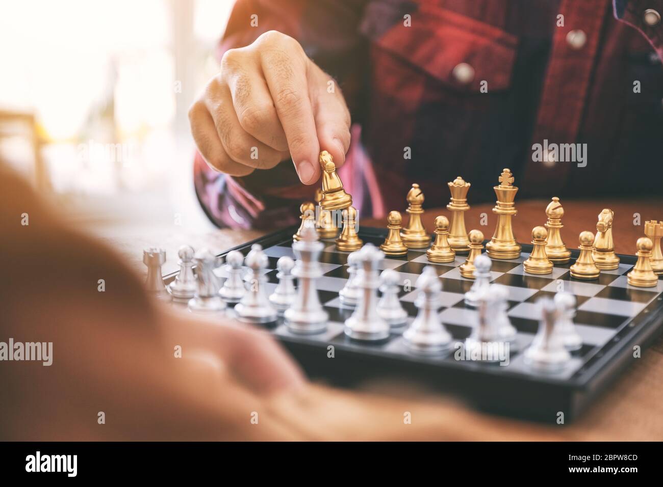 Closeup image of people moving and playing chessboard game together ...